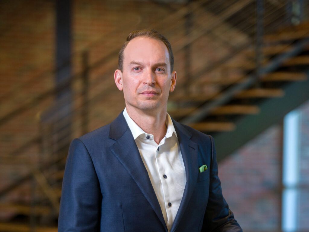 The winding path of CEO Paul Danos – 10/12 Industry Report